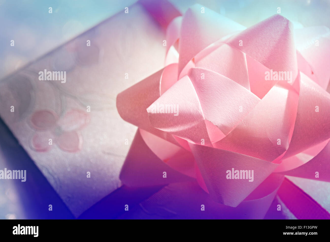 Gift box with a pink bow and ribbon Stock Photo - Alamy