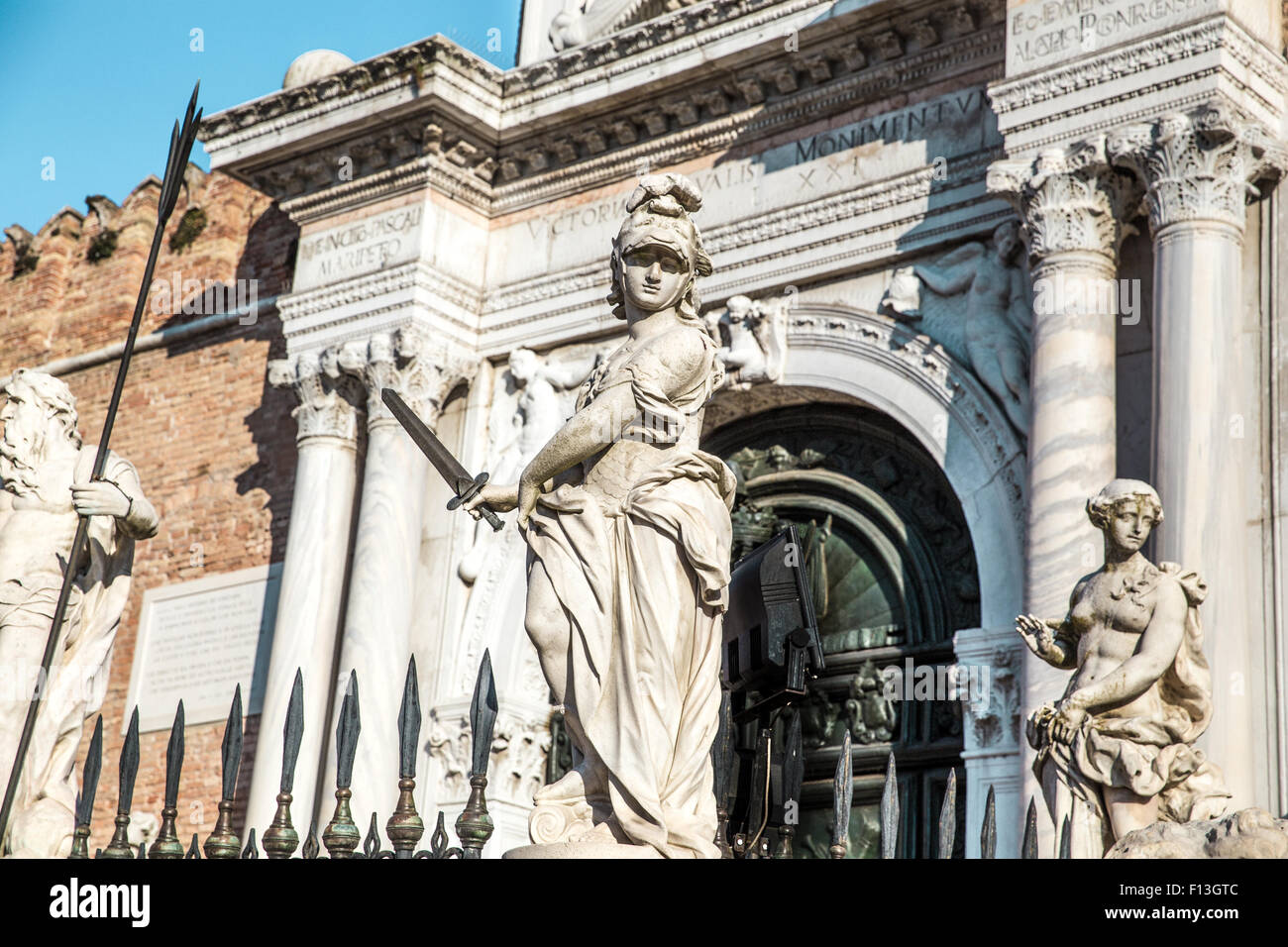 Statues guard the entrance of the old armory in Venice Stock Photo - Alamy