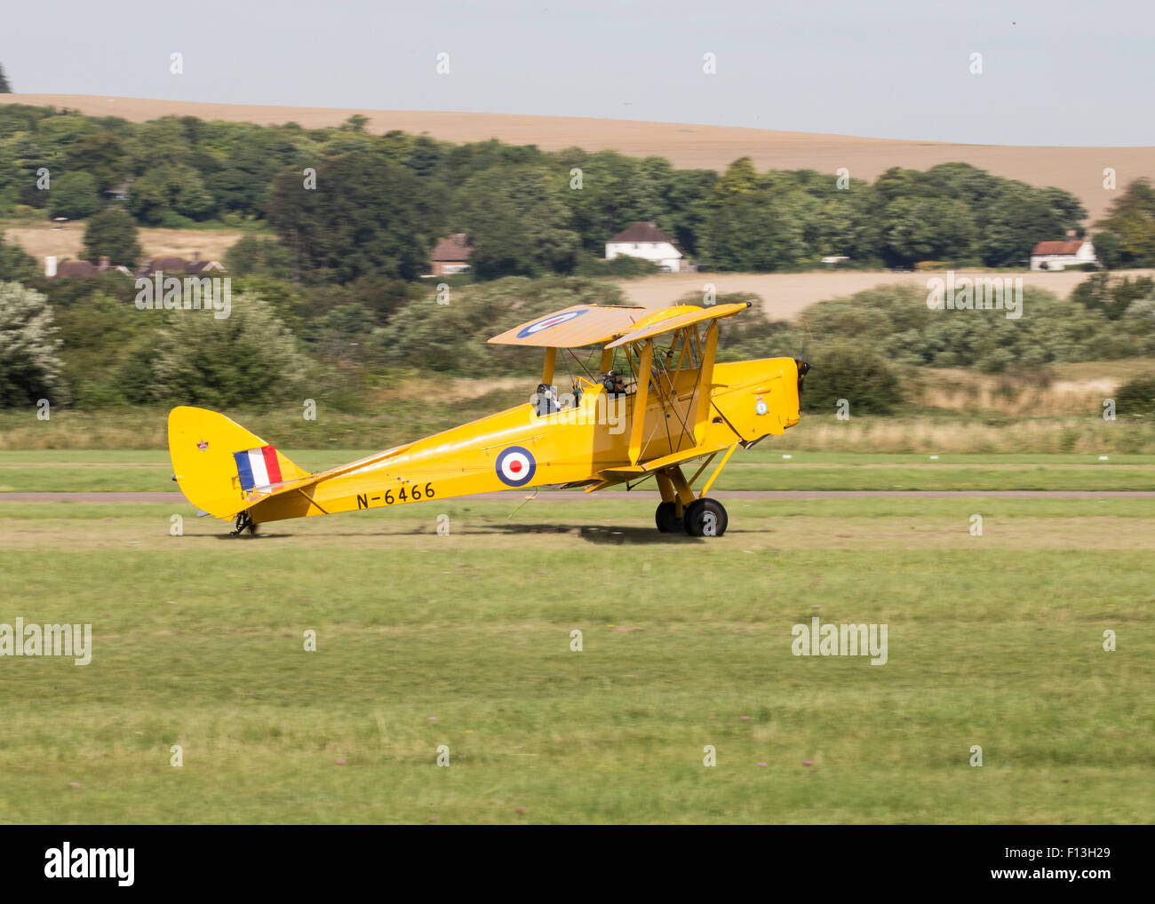 A Tiger Moth biplane aircraft in RAF trainer yellow flying at Shoreham ...