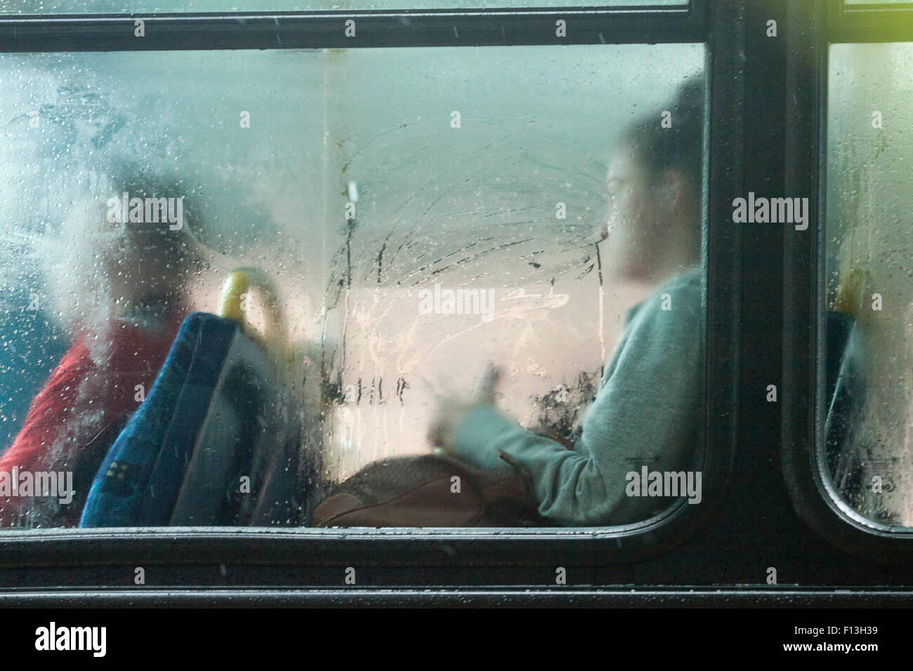 Wimbledon, London, UK. 26th August, 2015. A commuter seated in a bus ...