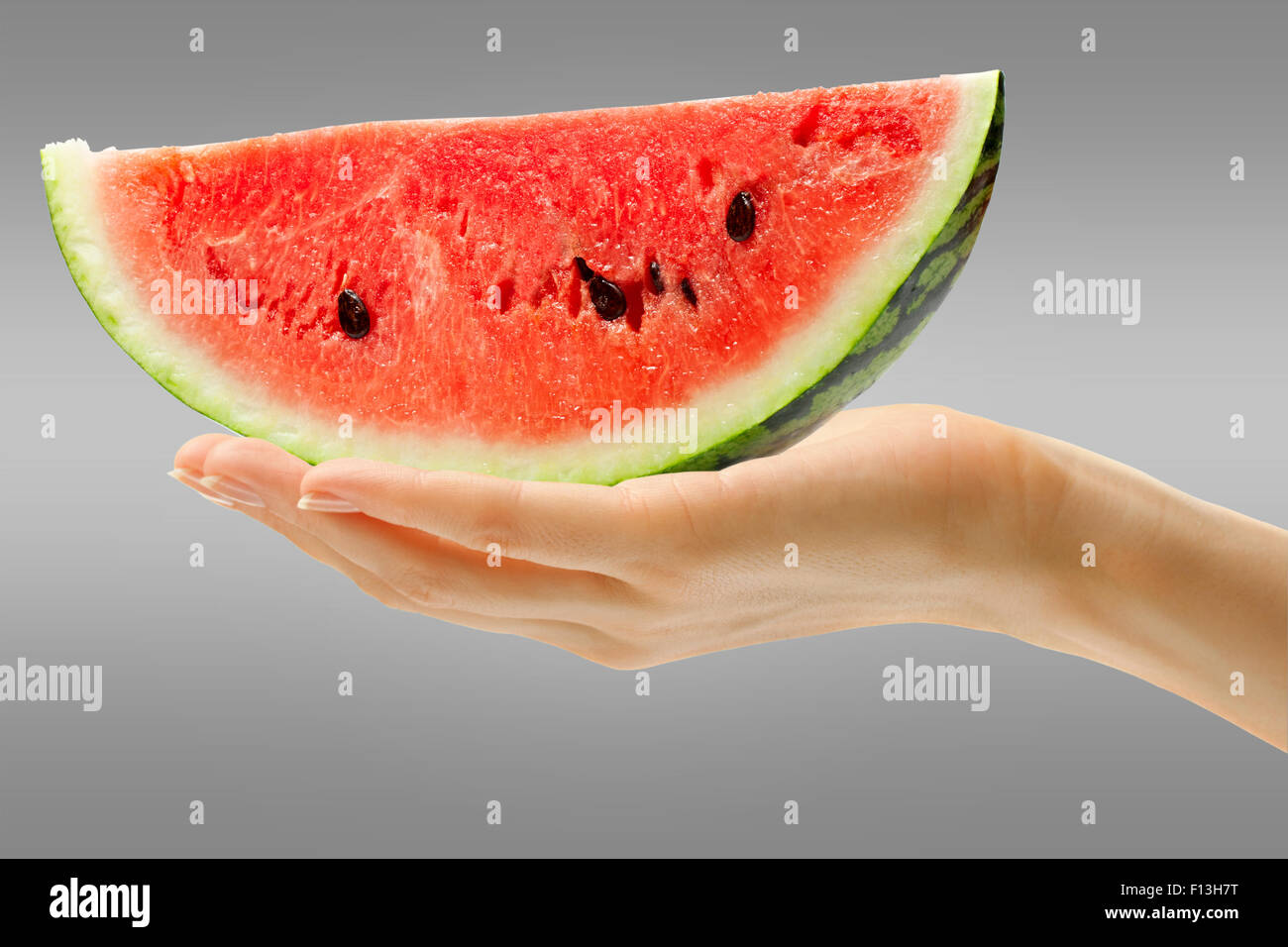 Watermelon in hand hi-res stock photography and images - Alamy