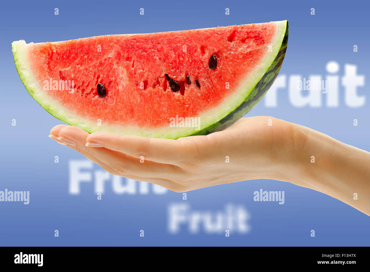 Female hand in closeup holding slice of watermelon Stock Photo - Alamy