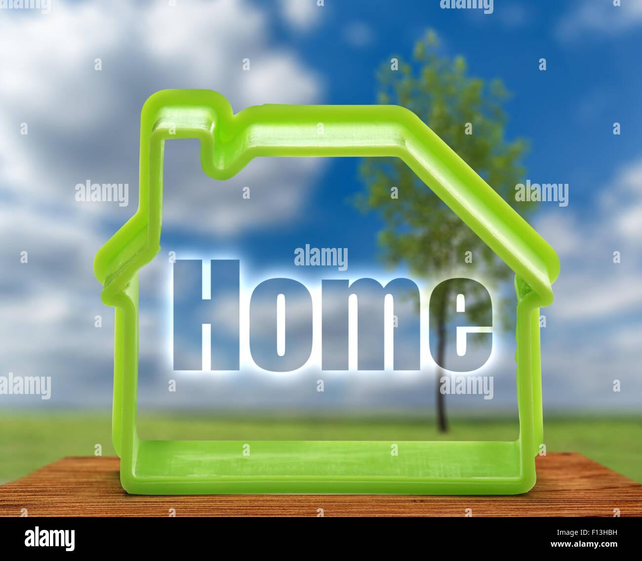 Toy house form as symbol on outdoors background Stock Photo - Alamy