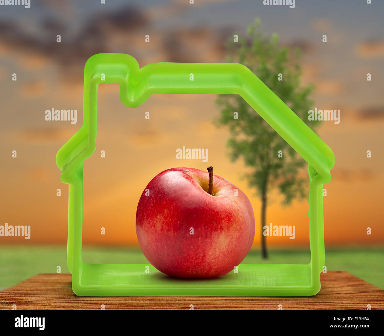 Toy house form with key as symbol outdoors Stock Photo - Alamy