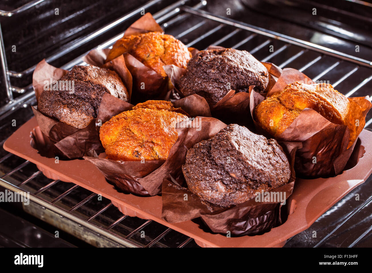 Baking muffins in the oven. Cooking in the oven Stock Photo - Alamy