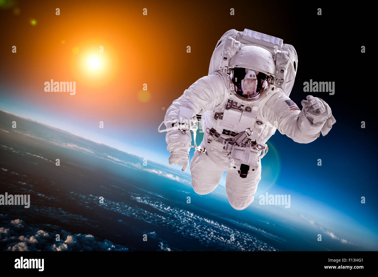 Astronaut in outer space against the backdrop of the planet earth ...