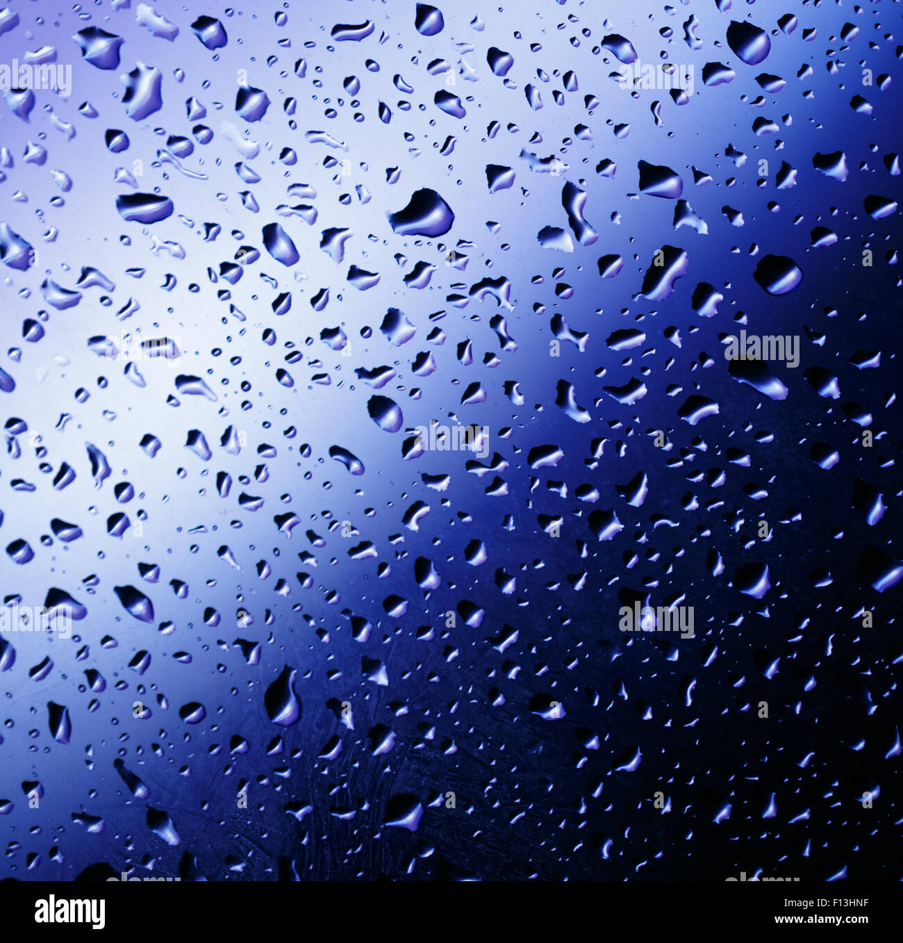 Cold rain drops on window as background Stock Photo - Alamy