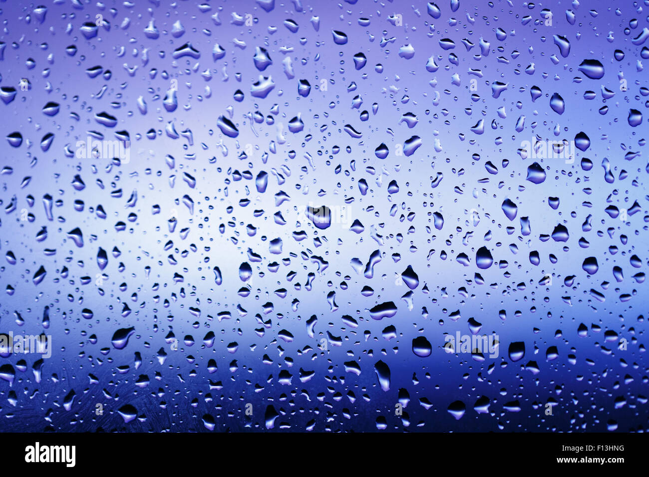 Cold rain drops on window as background Stock Photo - Alamy