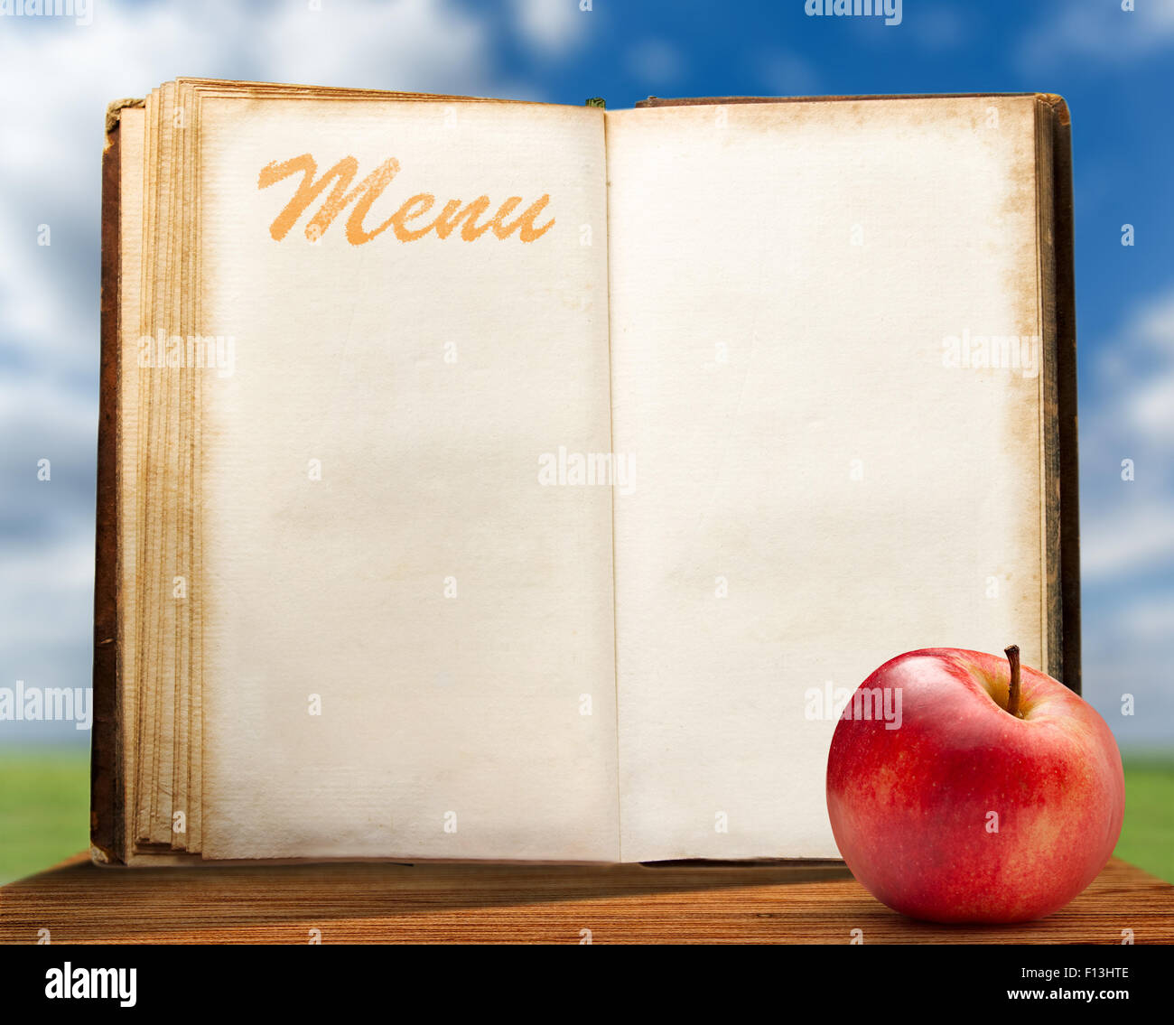 Open blank vintage menu book on sky background Stock Photo - Alamy