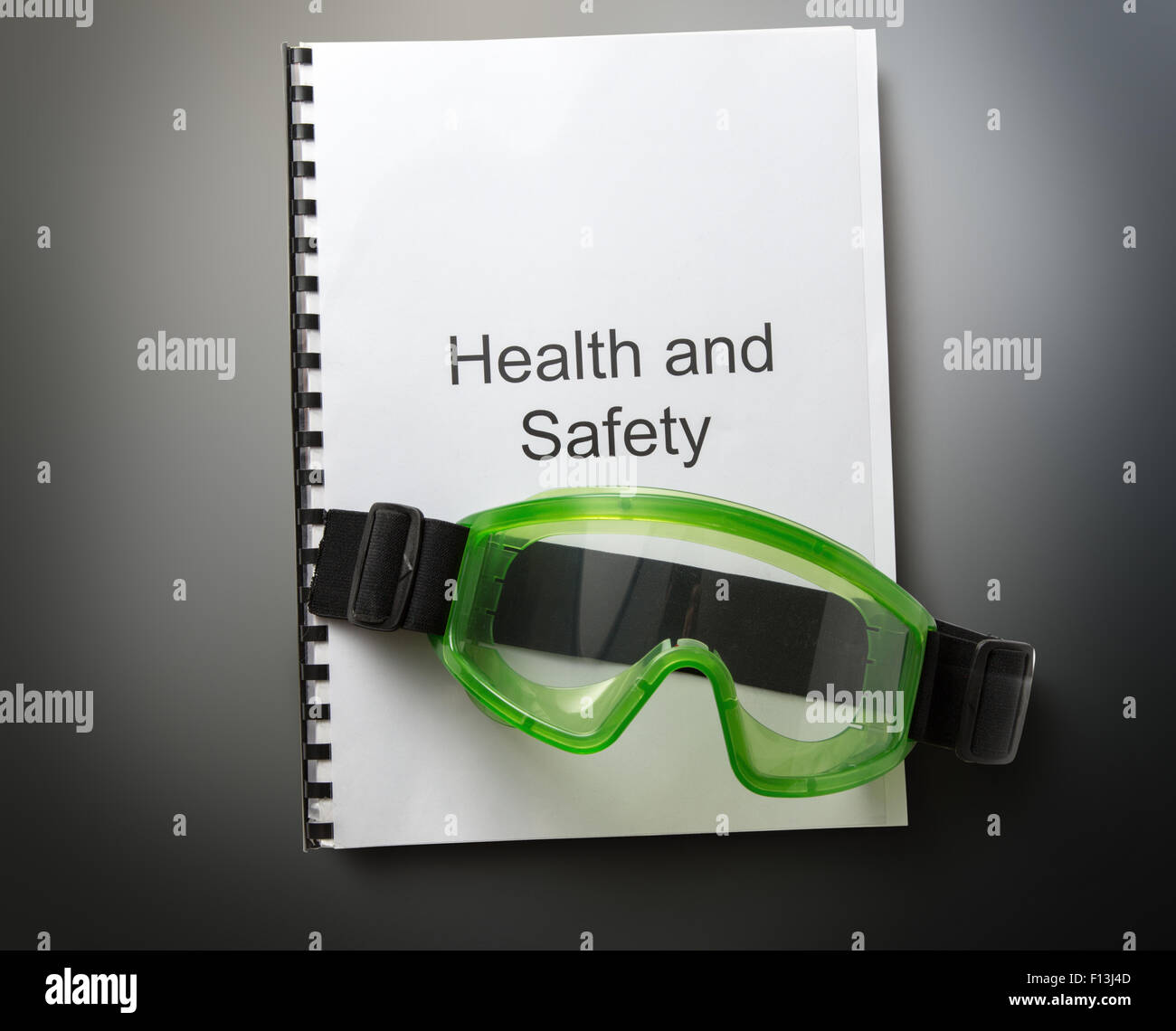 Health and safety register with goggles in closeup Stock Photo - Alamy