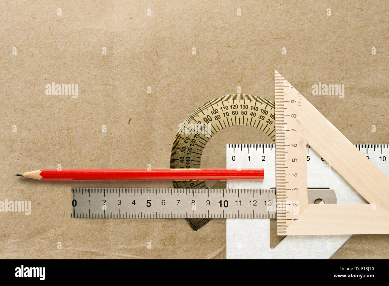Drafting tools with red pencil in closeup Stock Photo - Alamy