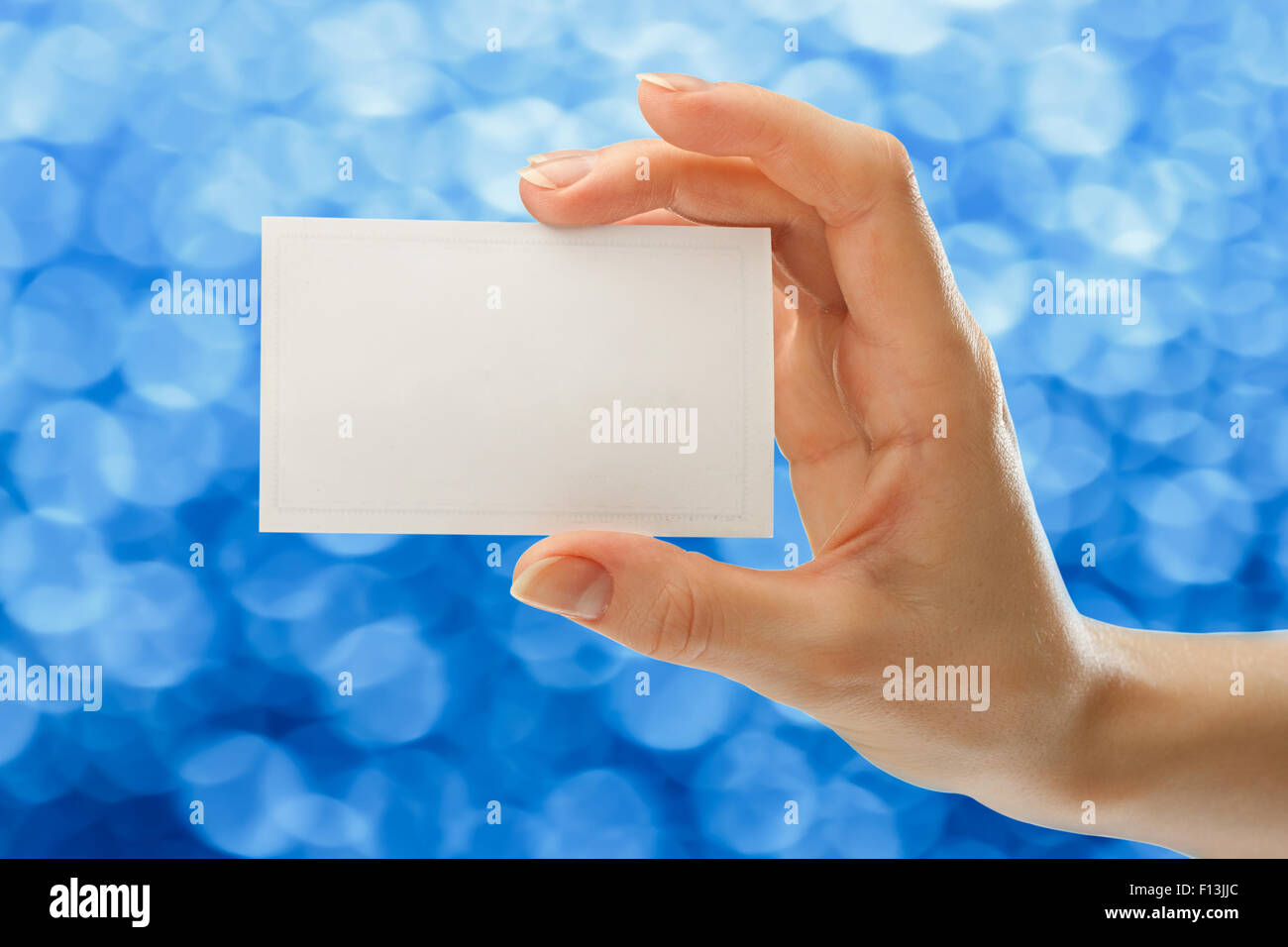 Blank card in hand hi-res stock photography and images - Alamy