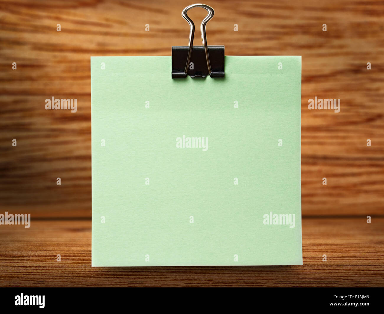 Blank sticker and clip on wooden background Stock Photo - Alamy