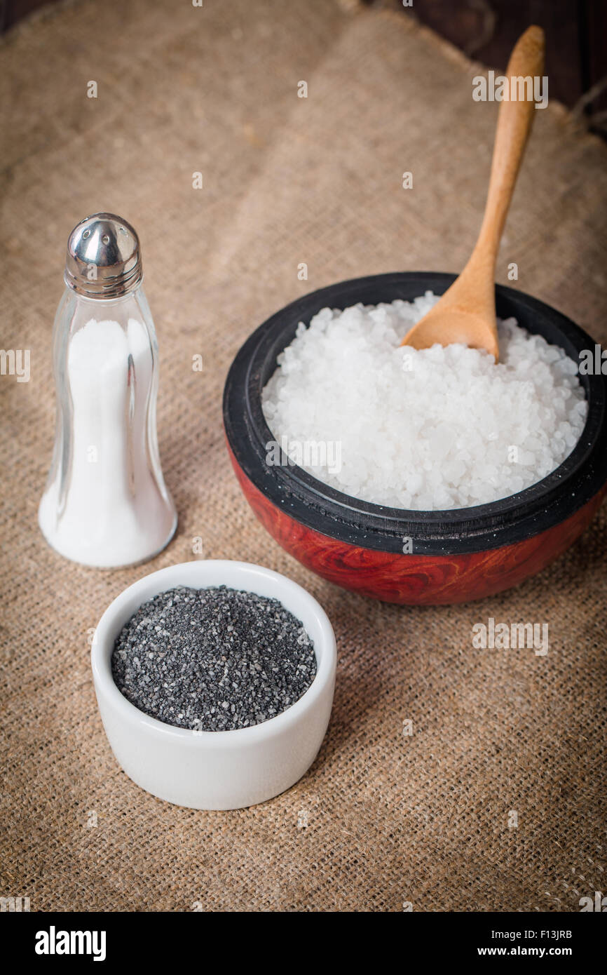 salt cellar, black and sea salt in bowl on burlap background Stock ...