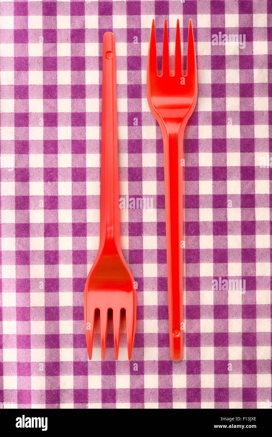 Red plastic forks vertical in close up Stock Photo - Alamy