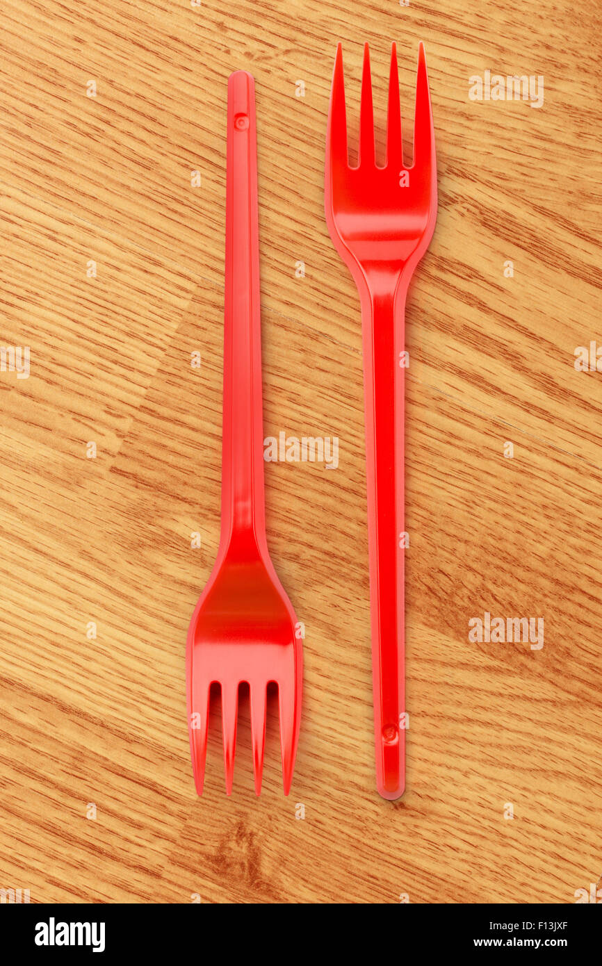 Red plastic forks vertical in close up Stock Photo - Alamy