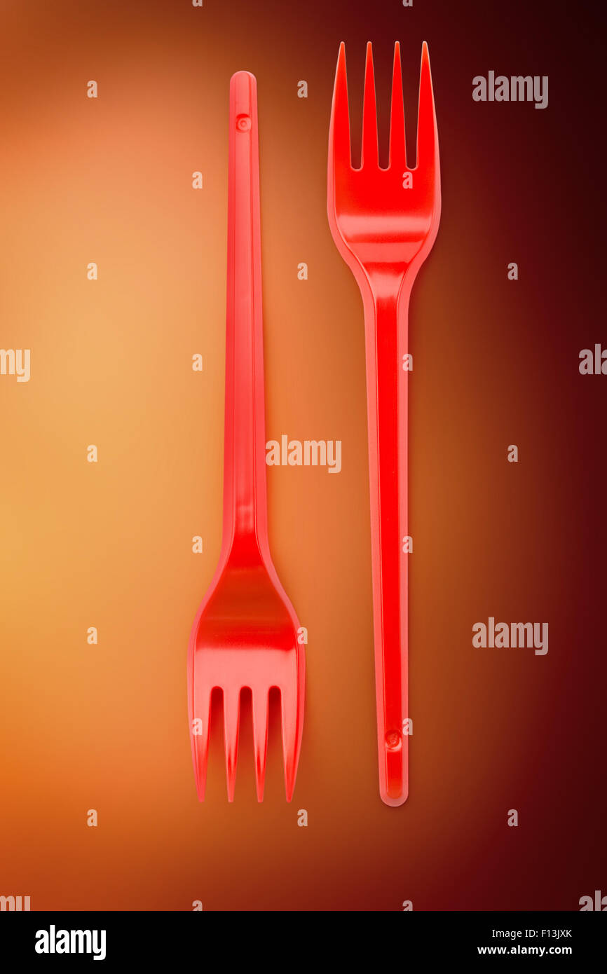 Red plastic forks vertical in close up Stock Photo - Alamy
