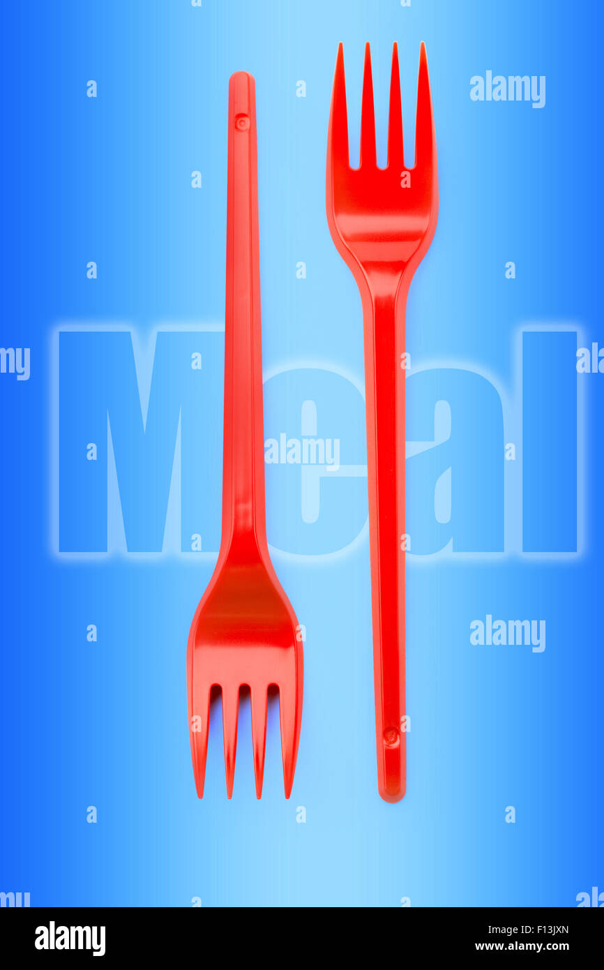 Red plastic forks vertical in close up Stock Photo - Alamy