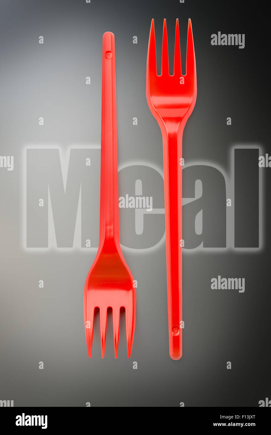 Red plastic forks vertical in close up Stock Photo - Alamy