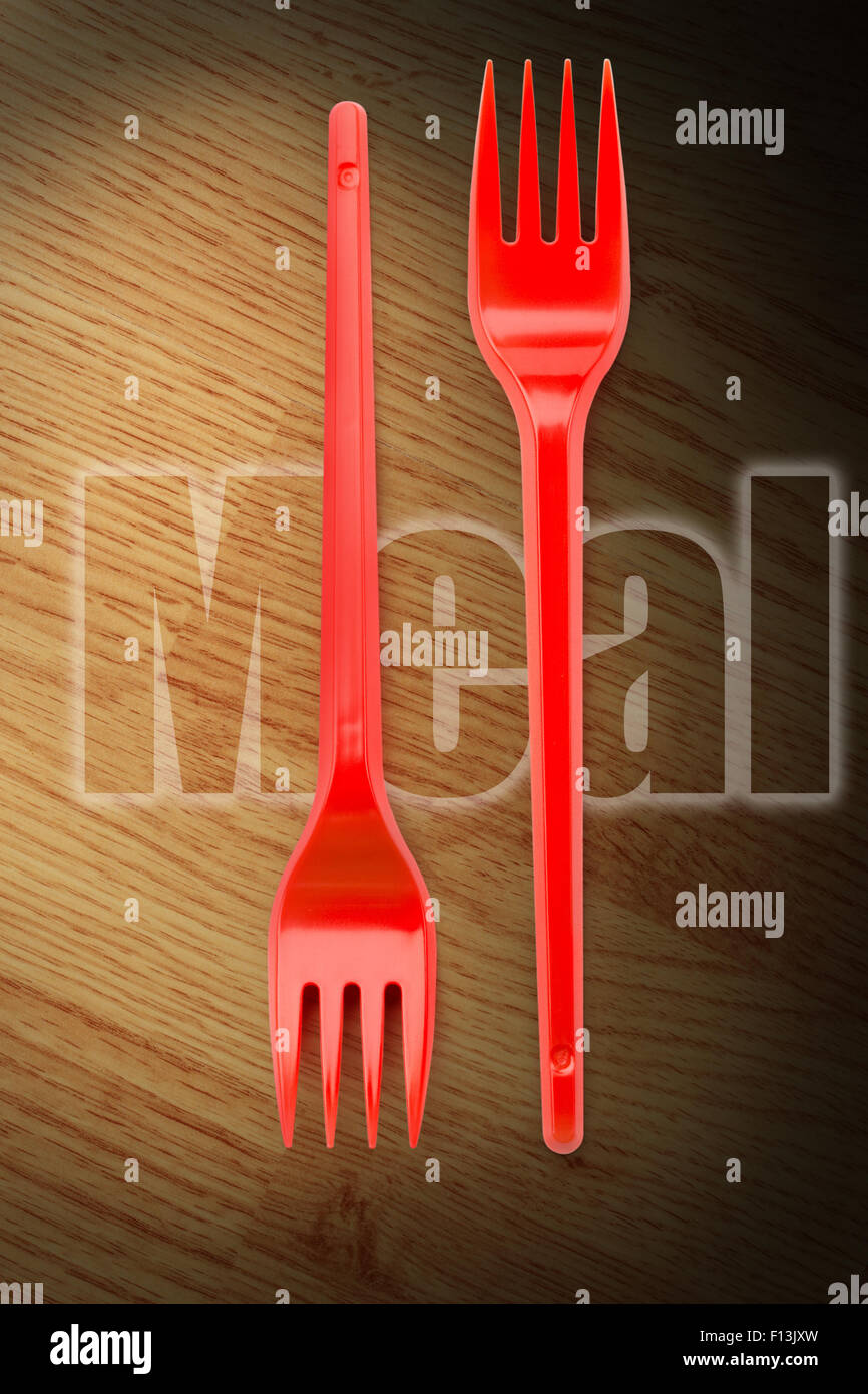 Red plastic forks vertical in close up Stock Photo - Alamy
