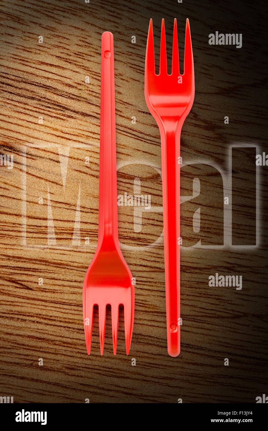 Red plastic forks vertical in close up Stock Photo - Alamy