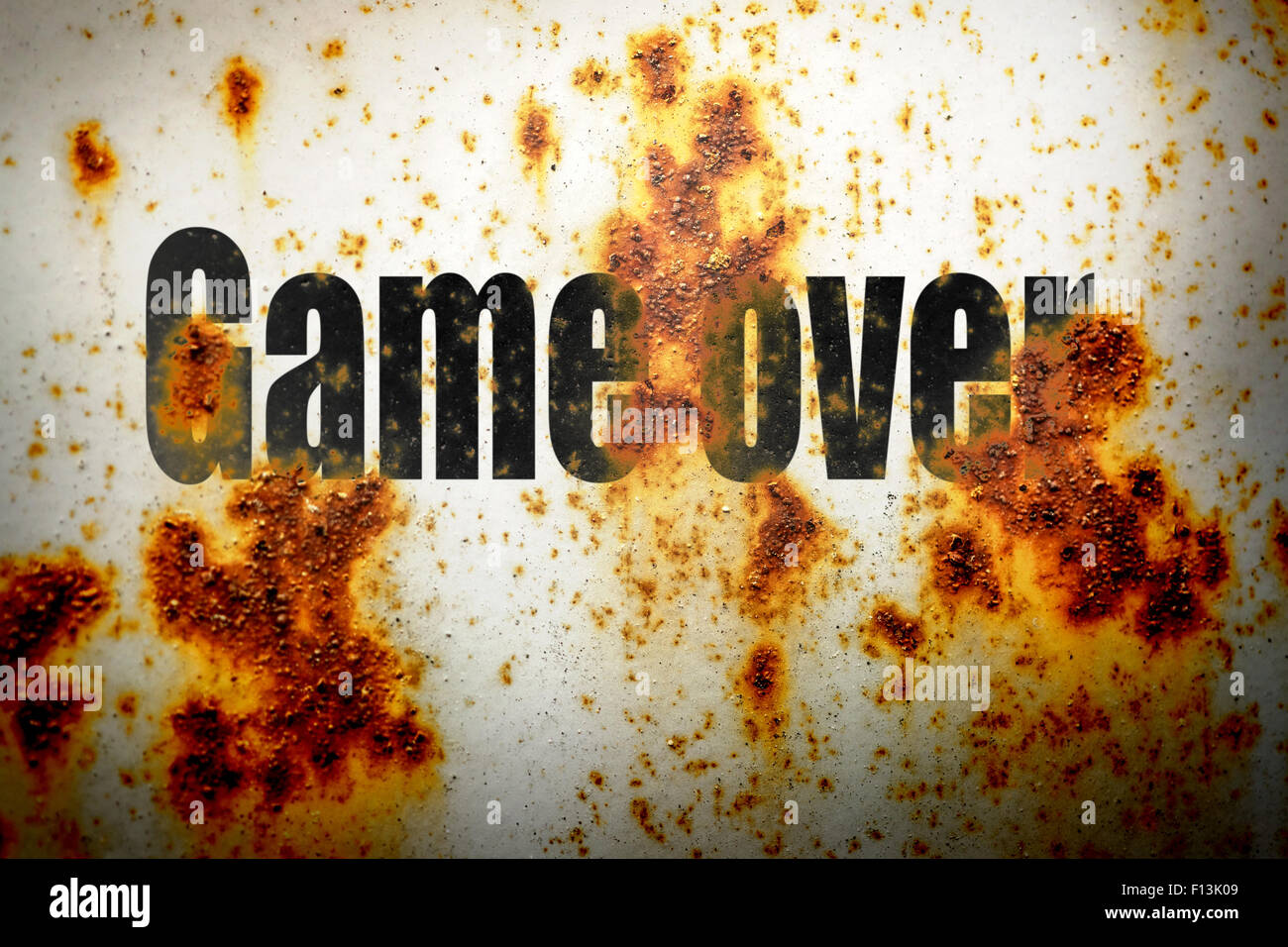 Game over on rusty piece of metal as background Stock Photo - Alamy