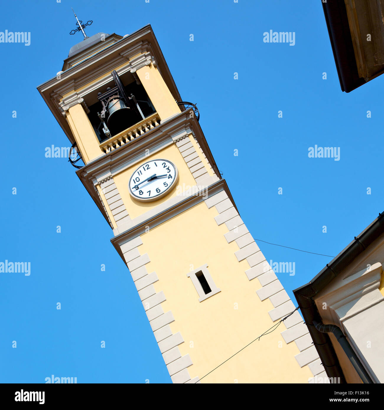 ancien clock tower in italy europe old stone and bell Stock Photo - Alamy