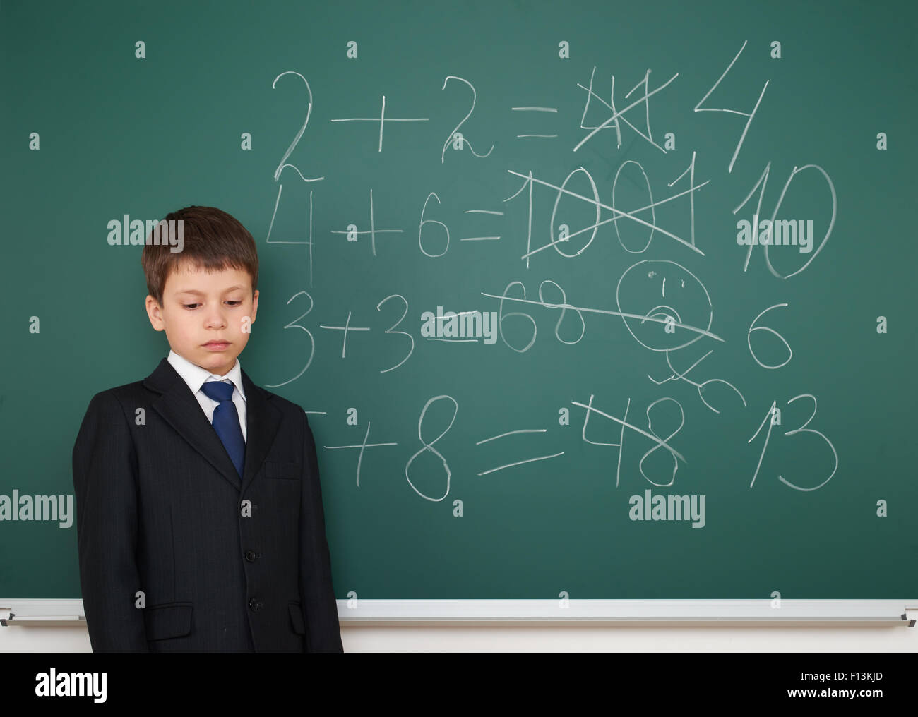 School boy solve math on the school board Stock Photo - Alamy