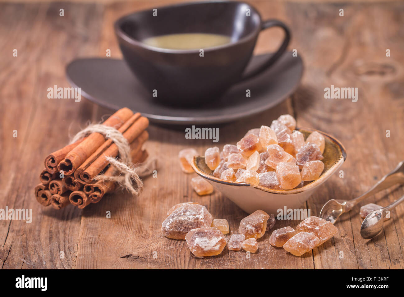 Cinnamon sticks with caramelized sugar on wooden table background Stock ...