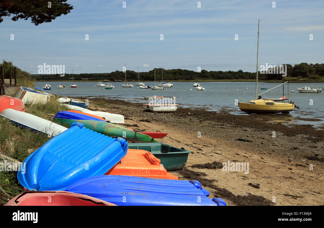 Rowing boats on the shoreline at low tide at Cale de La Garenne, La ...