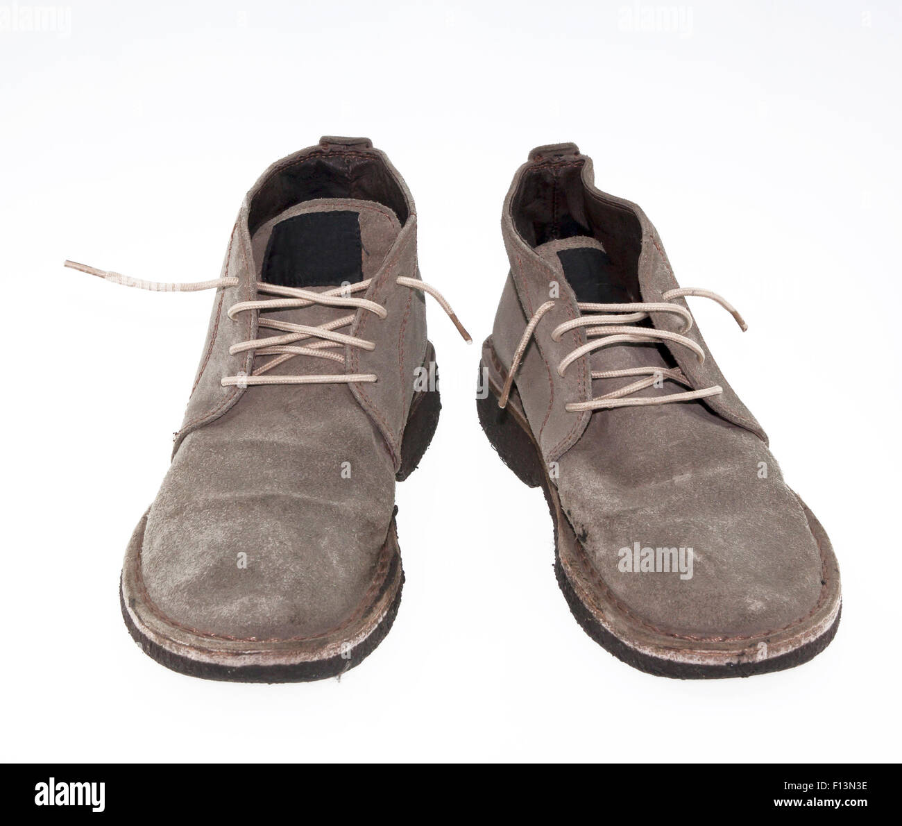Old brown leather shoes isolated on white background Stock Photo - Alamy