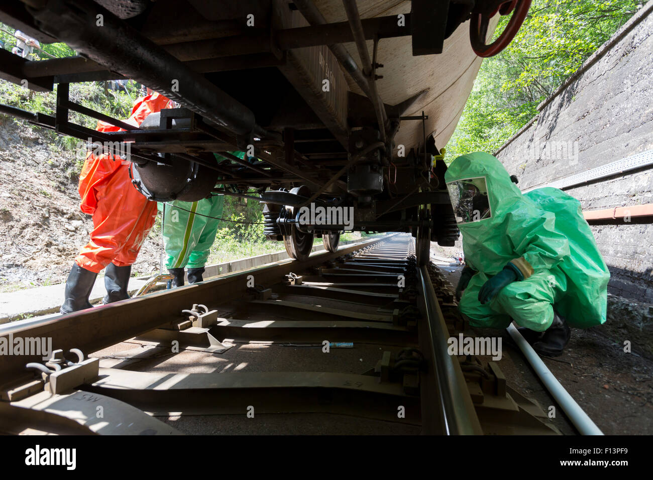 A team working with toxic acids and chemicals is securing a chemical ...