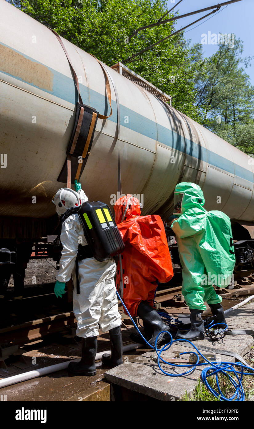 A team working with toxic acids and chemicals is securing a chemical ...