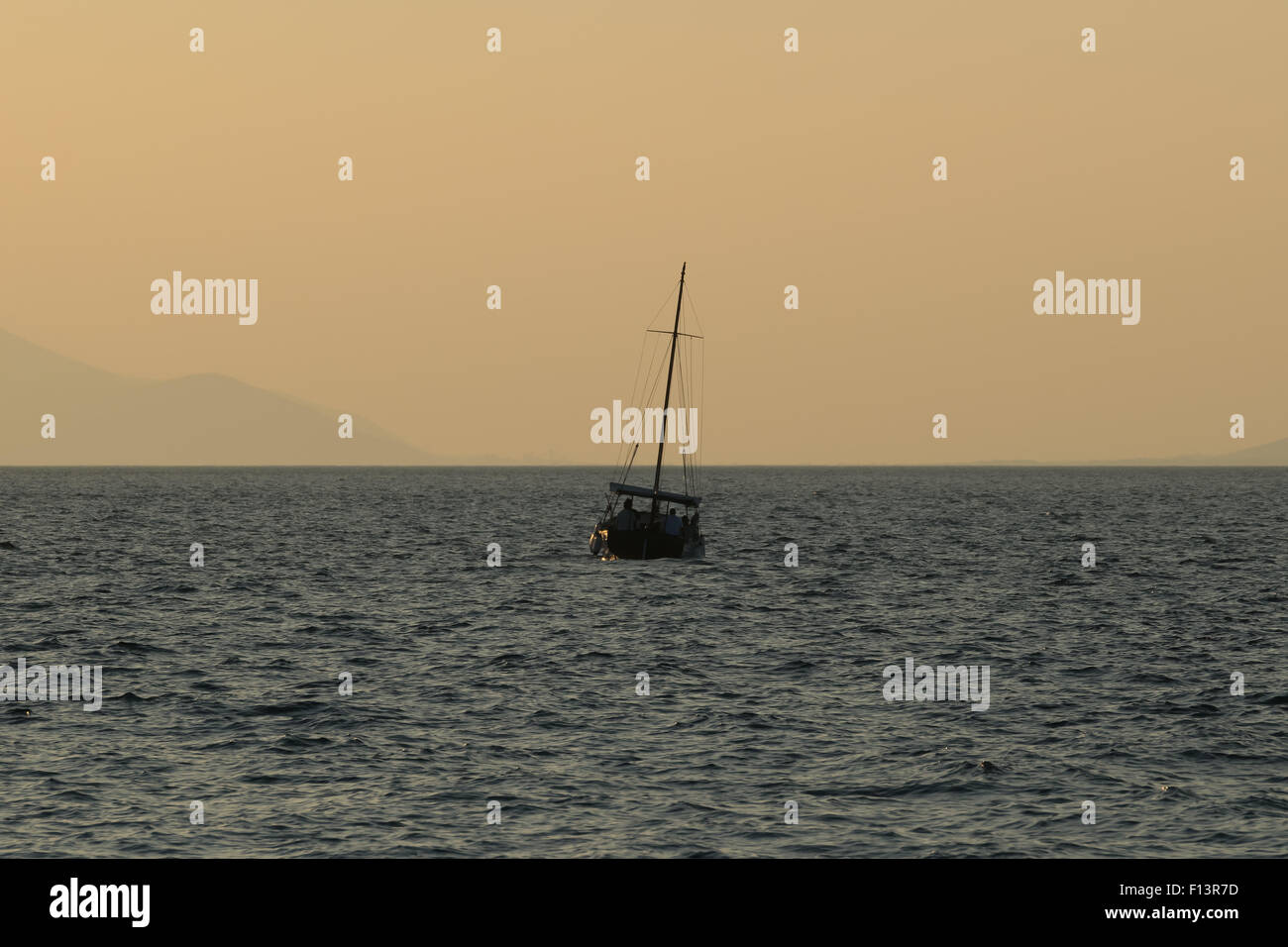 Sailboat leaving port against the horizon Stock Photo - Alamy