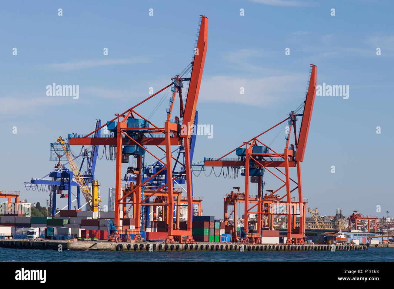 Orange Port Cranes in a sea port Stock Photo - Alamy