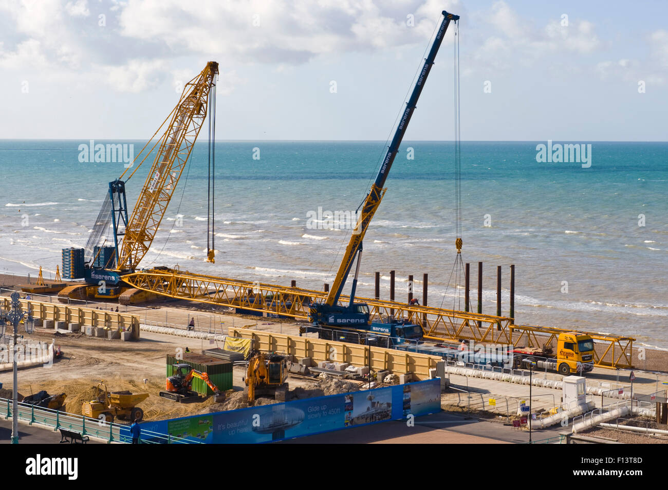 construction site - Cranes assemble a giant crane in readiness to build ...