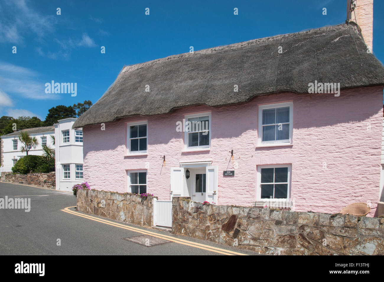 Thatched pink cottage hi-res stock photography and images - Alamy