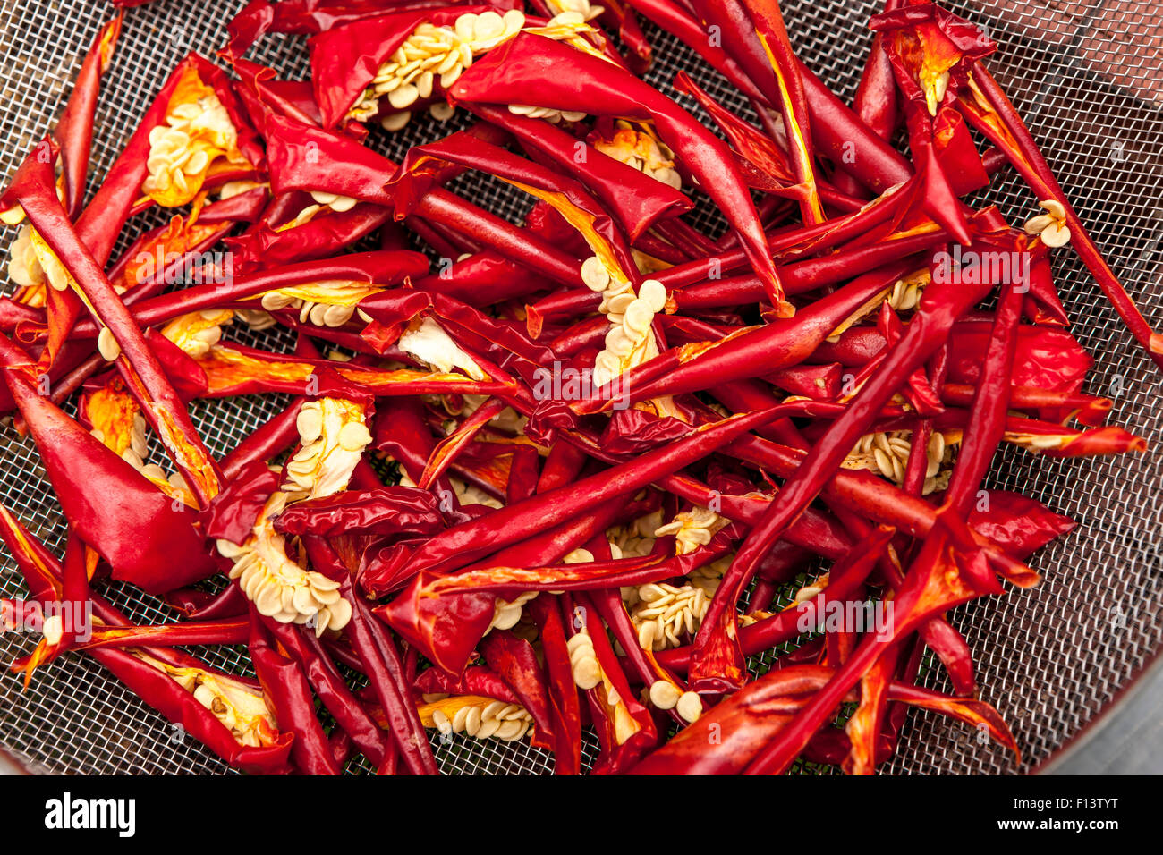 Red peppers drying Stock Photo - Alamy
