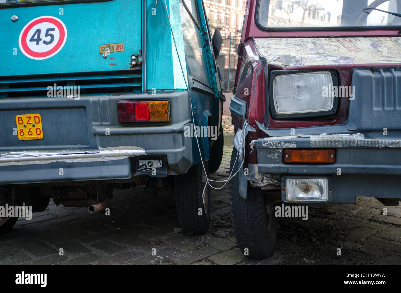 Vintage cars joined by a rope. Getting older together Stock Photo - Alamy