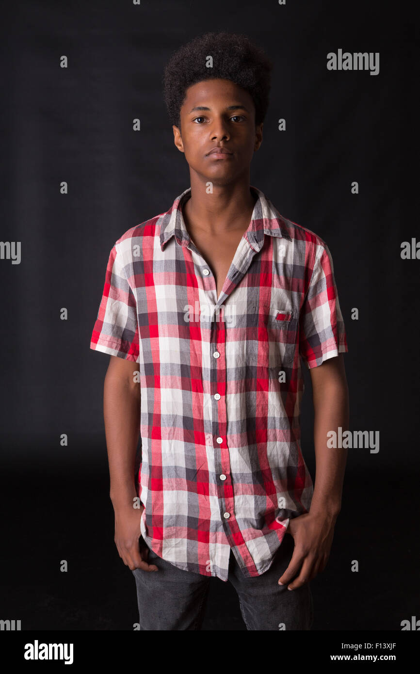 A casual young black Boy posing isolated Stock Photo - Alamy