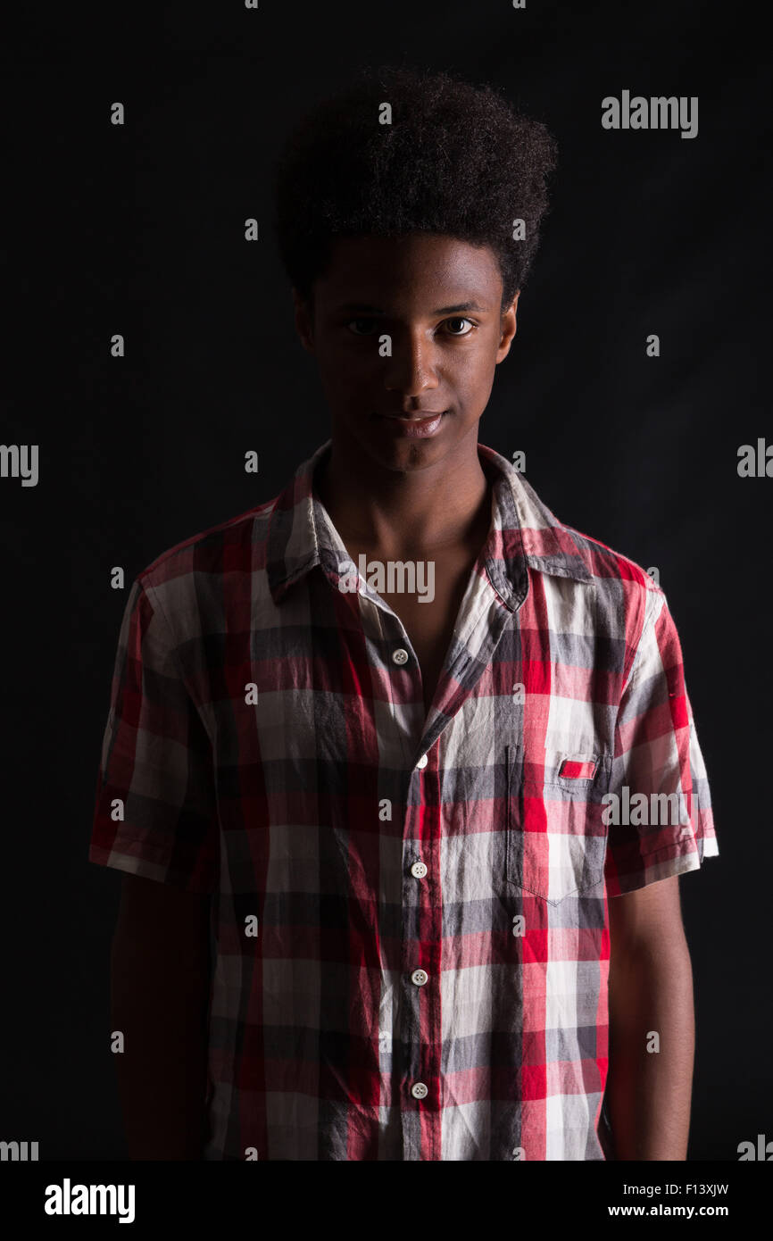 A casual young black Boy posing isolated Stock Photo - Alamy
