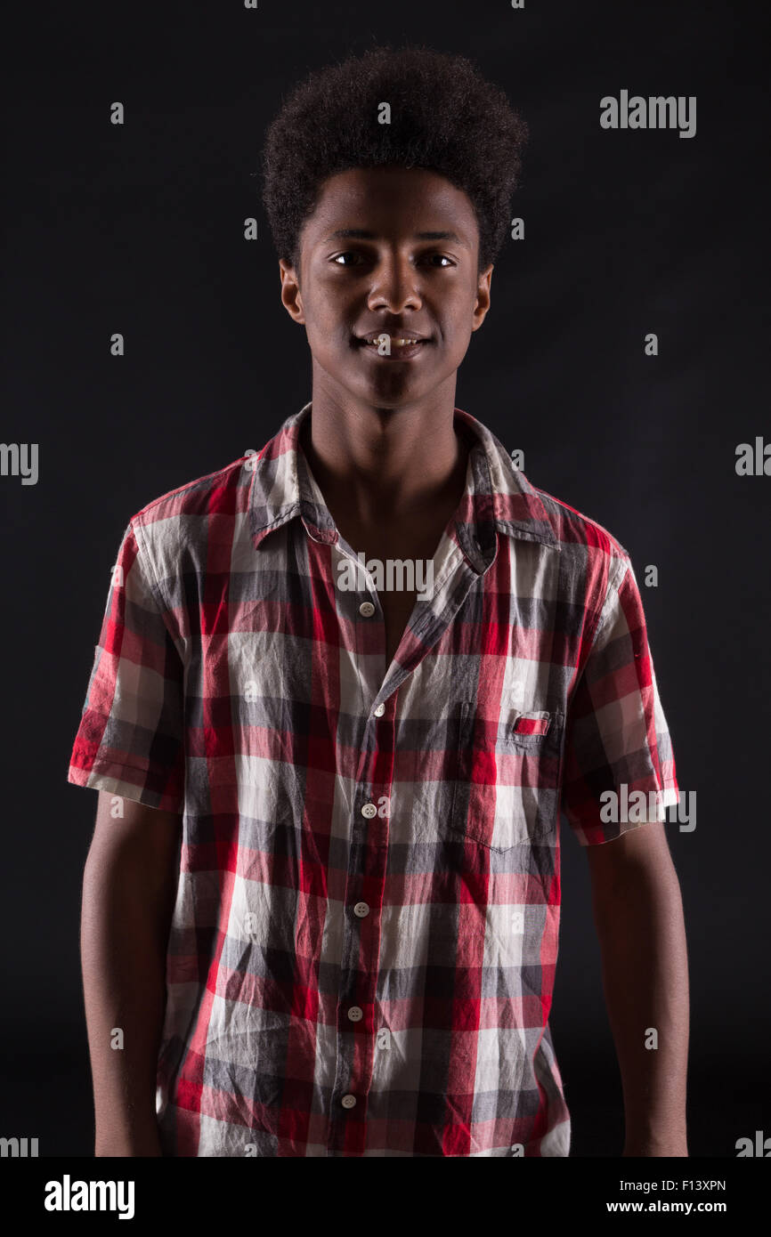 A casual young black Boy posing isolated Stock Photo - Alamy