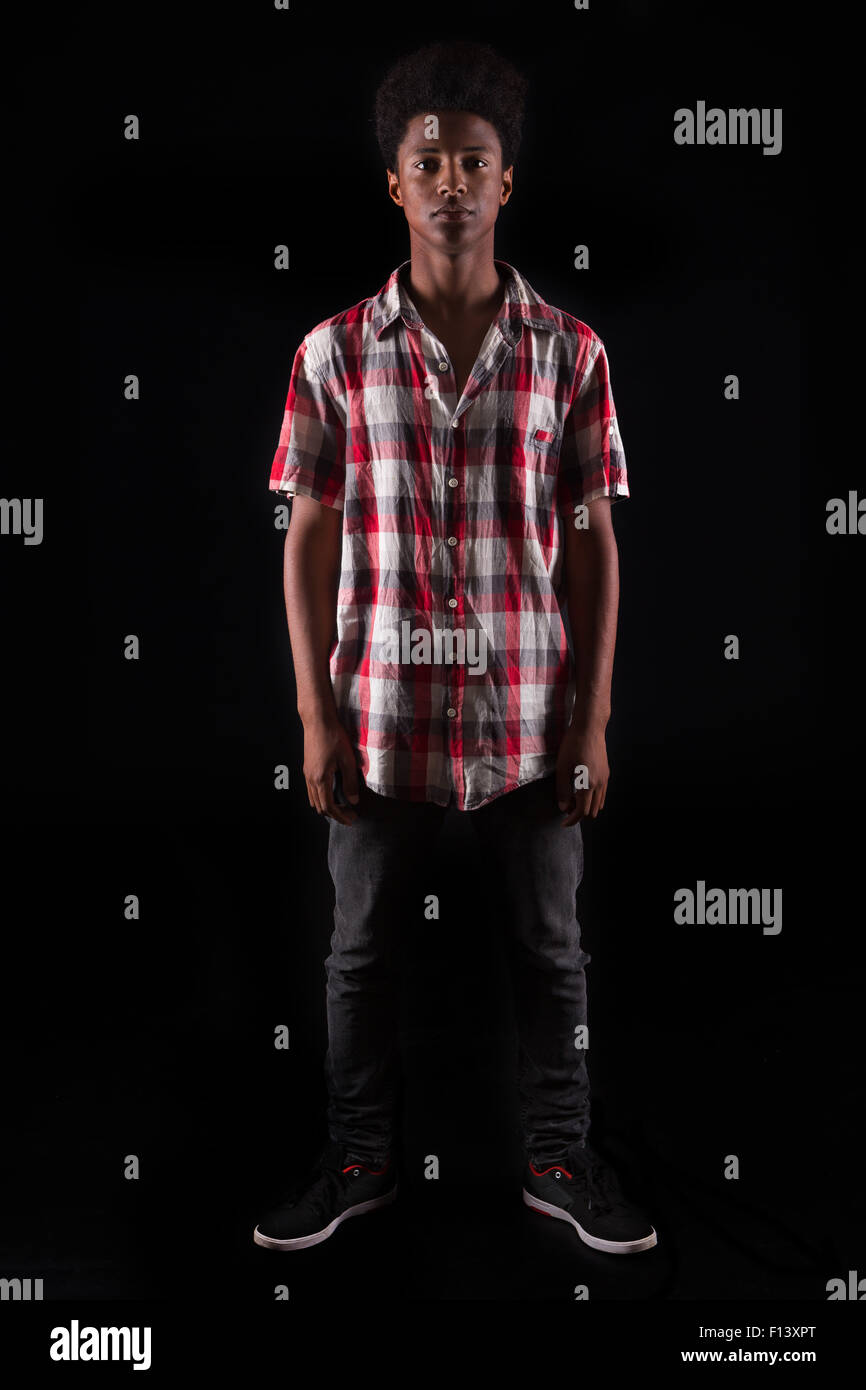A casual young black Boy posing isolated Stock Photo - Alamy