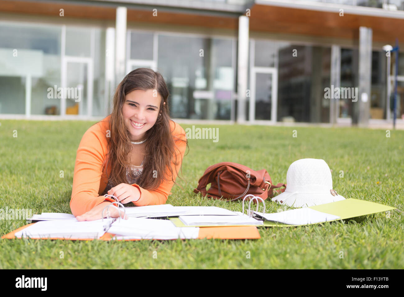 Young woman studying at the university campus Stock Photo - Alamy