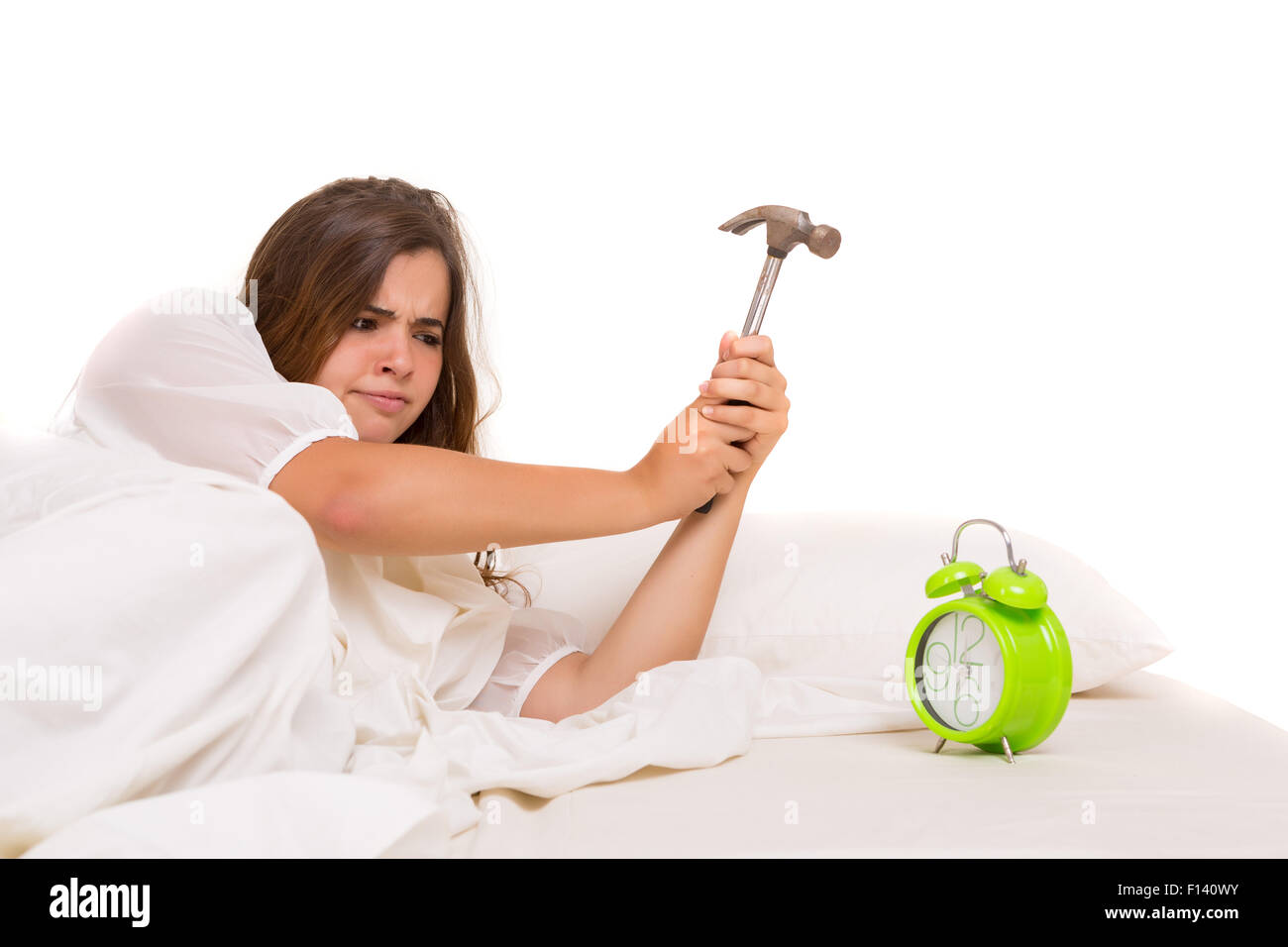 Woman waking up with the sound of the alarm clock Stock Photo - Alamy