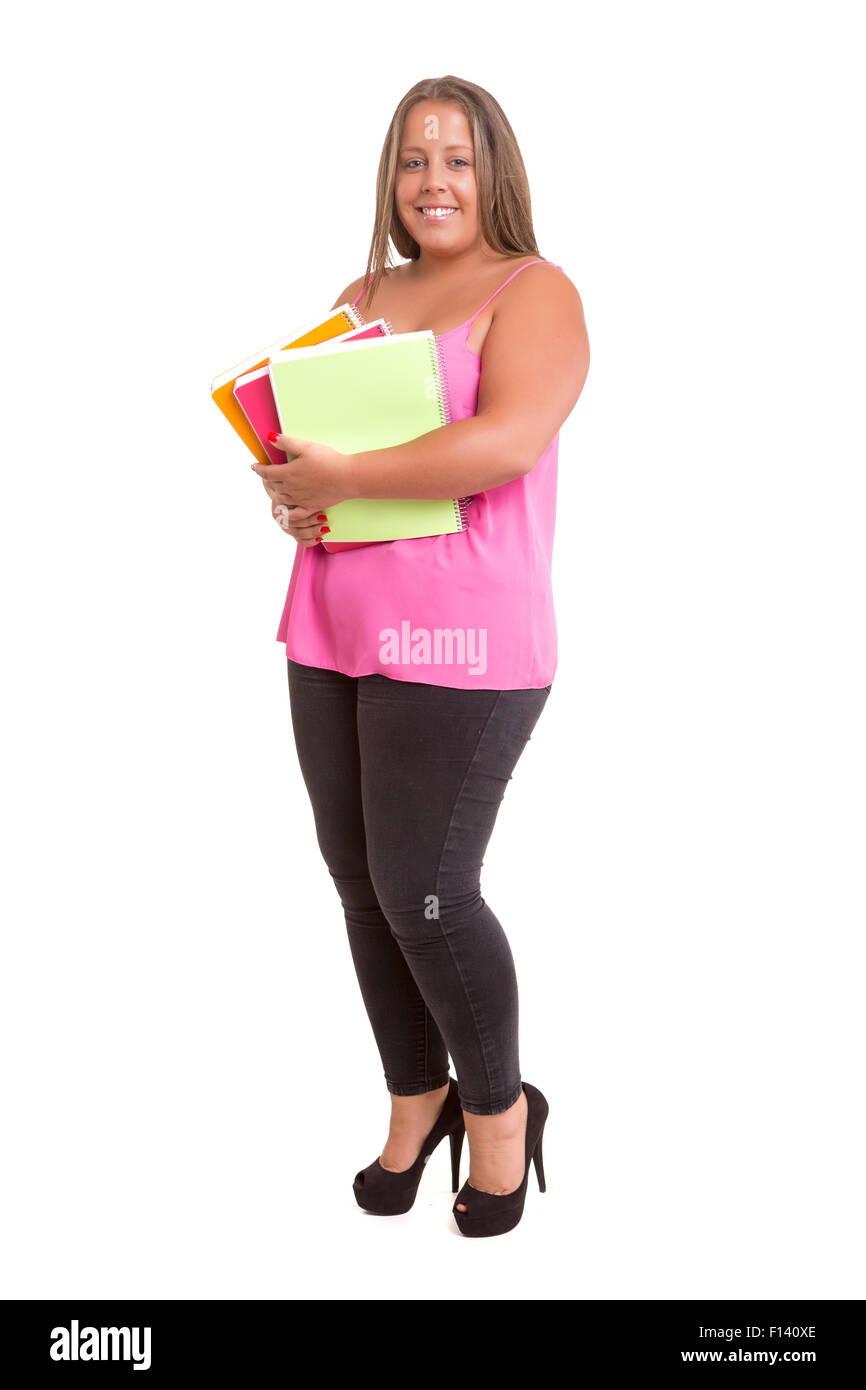 A beautiful large student woman, posing isolated over white background ...