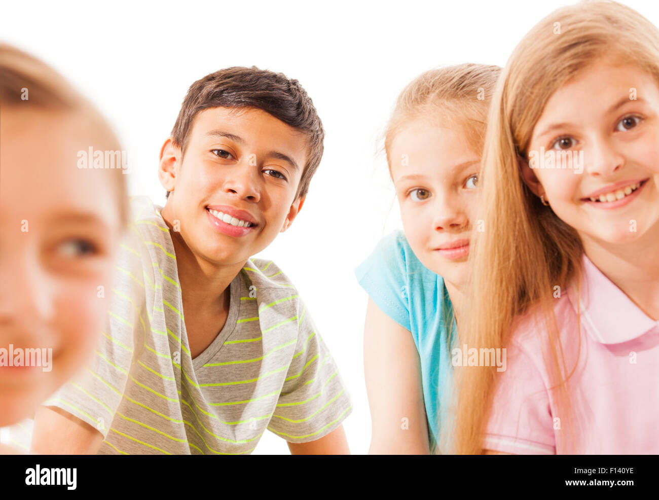 Boy on the back in focus with friends Stock Photo - Alamy