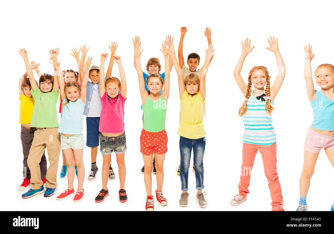 Kids stand together boys and girls rise hands Stock Photo - Alamy