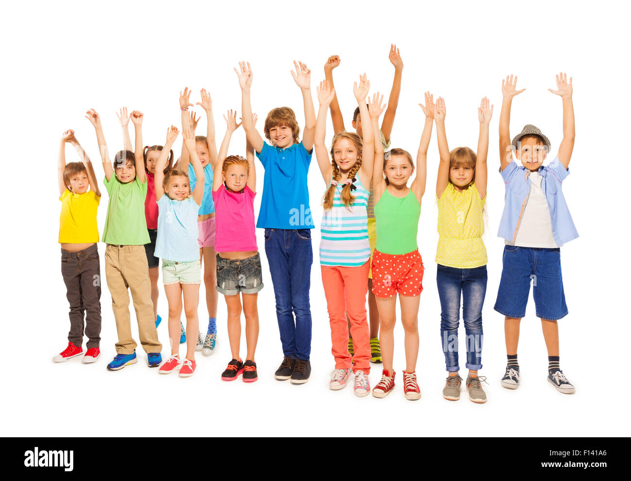 Many different kids with raised in the air hands Stock Photo - Alamy