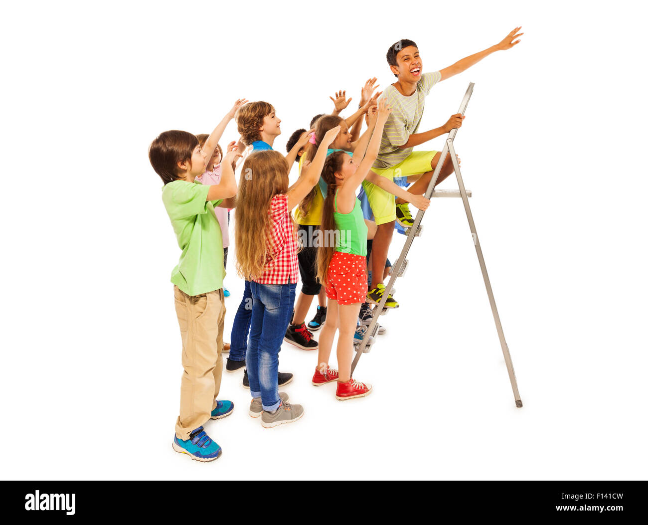 Group of kids trying to be first on ladder Stock Photo - Alamy